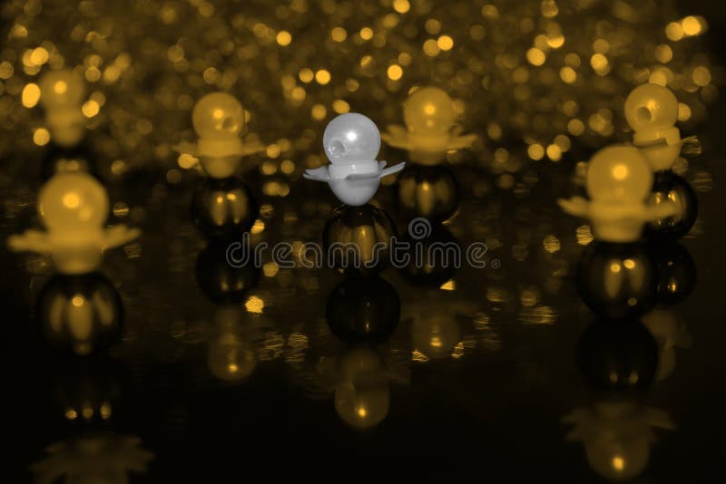 White Small Plastic Objects with Yellowish Background Stock Image ...