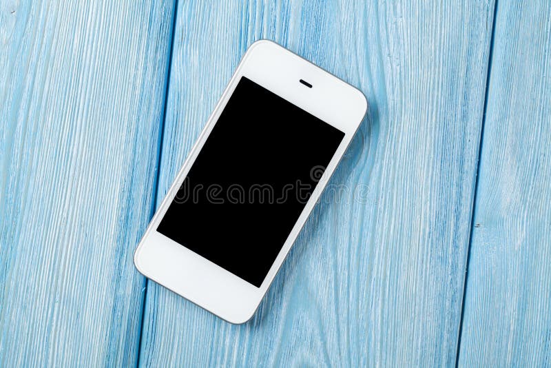 White Smartphone on Wooden Table Stock Image - Image of blue ...