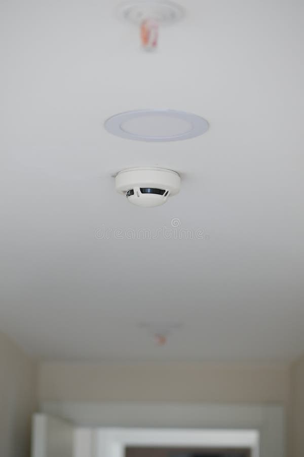 White Smoke Detector on Ceiling at Home Stock Photo - Image of ...