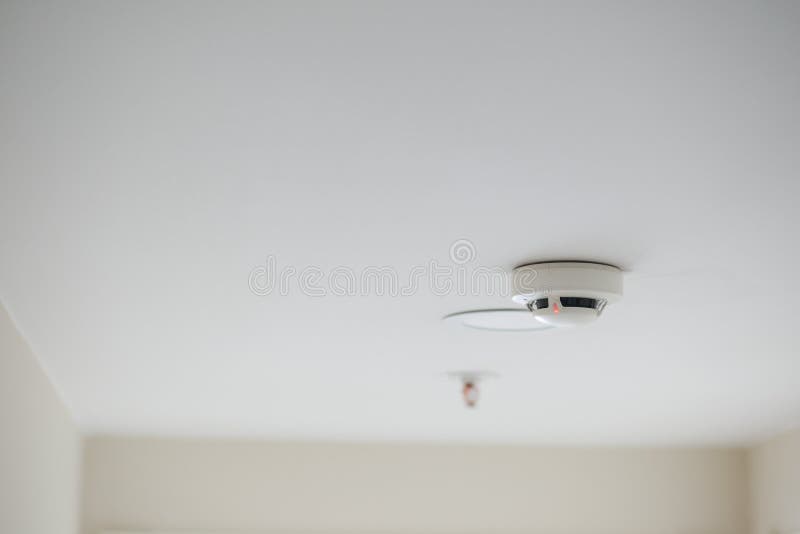White Smoke Detector on Ceiling at Home Stock Image - Image of ...