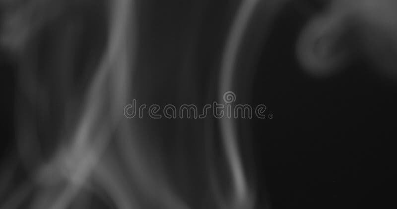 White Smoke Floating through Space Against Black Background Stock ...