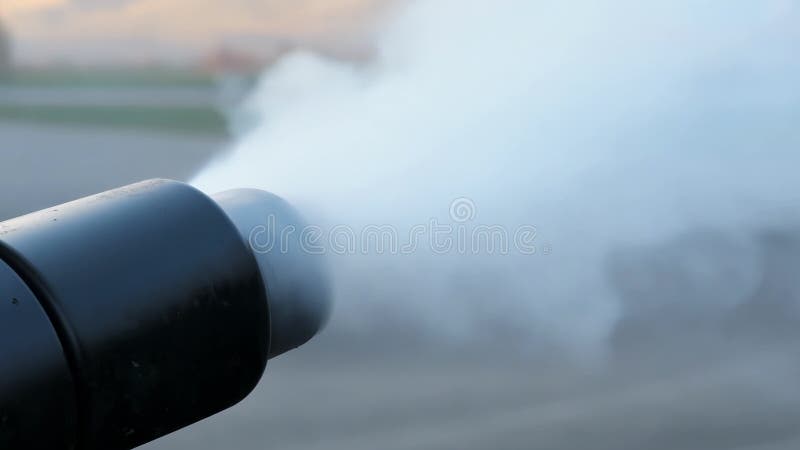White Smoke Rises from the Exhaust Pipe Intensifying with Each Rev of ...