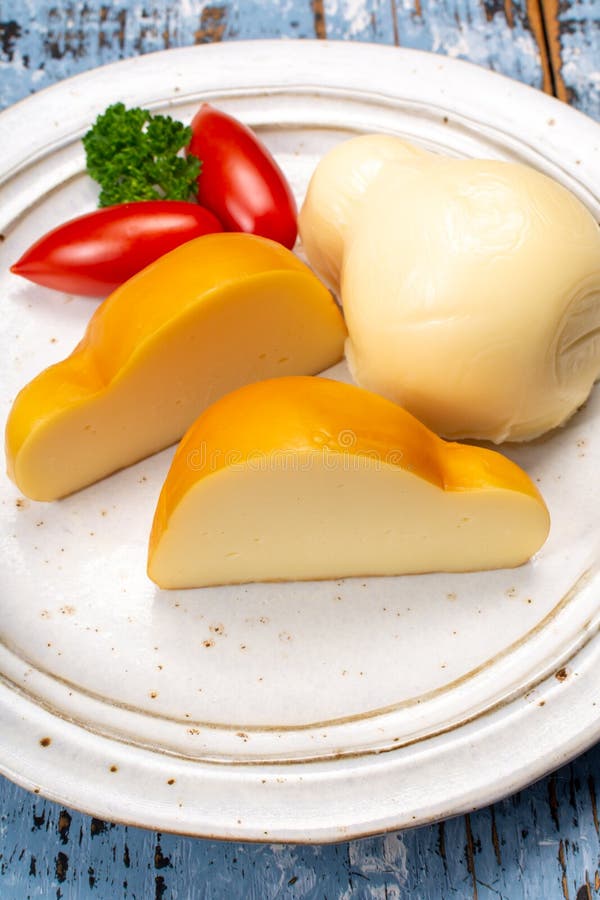 White and Smoked Yellow Italian Scamorza Cheese Stock Image - Image of ...