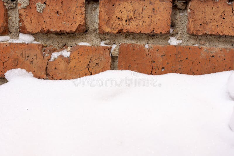 White Snow Near a Red Brick Wall Stock Image - Image of close, season ...