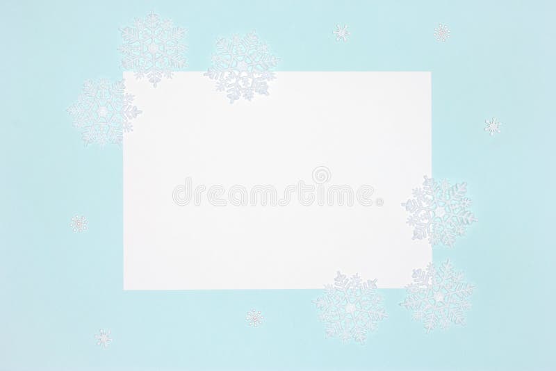 White Snowflake Decorations with Blank Paper on Blue Background. Winter ...