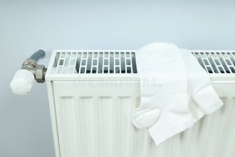 White Socks Drying on a Radiator Indoor Stock Photo - Image of electric ...