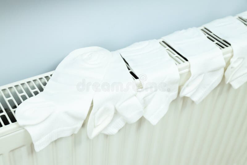 White Socks Drying on a Radiator Indoor Stock Photo - Image of radiator ...