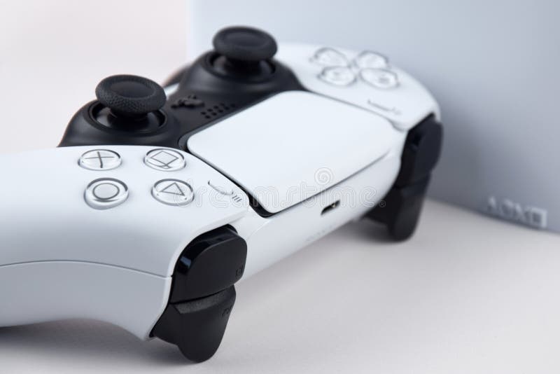 The White Sony PlayStation 5 and Controller on the White Table ...