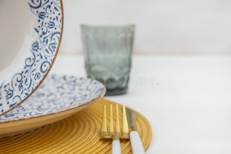 A White Soup Plate with a Blue Pattern on the Edges Stands Directly on ...