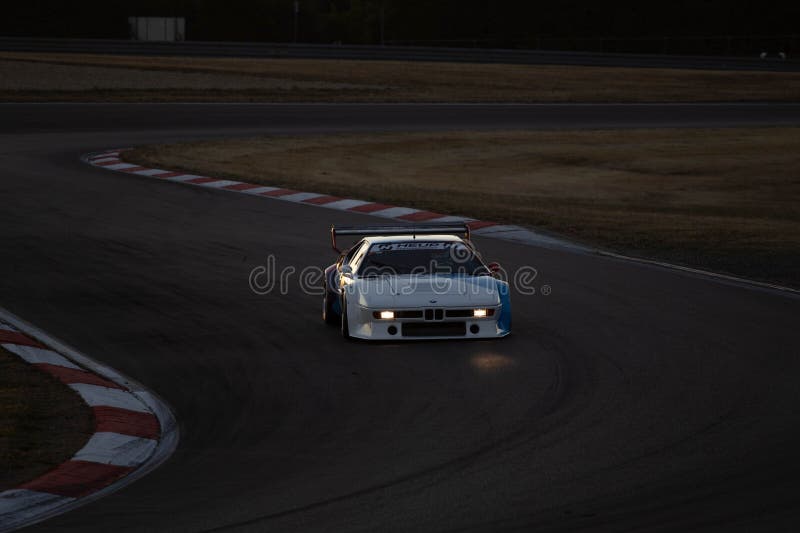 White Sports Car Driving on a Race Track Editorial Image - Image of ...