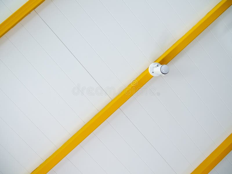 White Spot LED Light Install on Yellow Edge on White Ceiling Stock ...