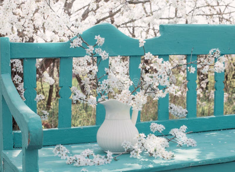 White Spring Flowers on Bench in Garden Stock Photo - Image of flower ...