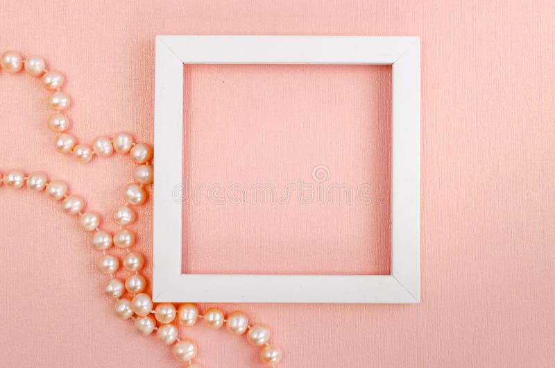 White Square Frame With Pearl Beads On A Pink Pearl Design Board Stock ...
