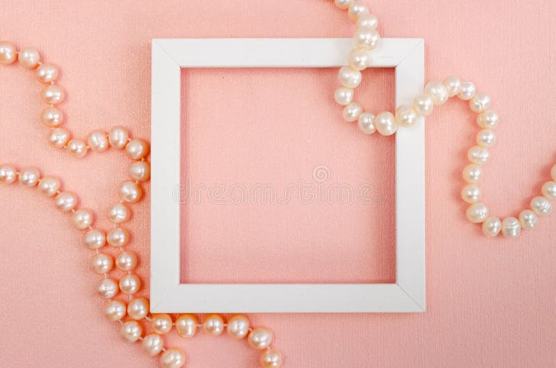 White Square Frame With Pearl Beads On A Pink Pearl Design Board Stock ...