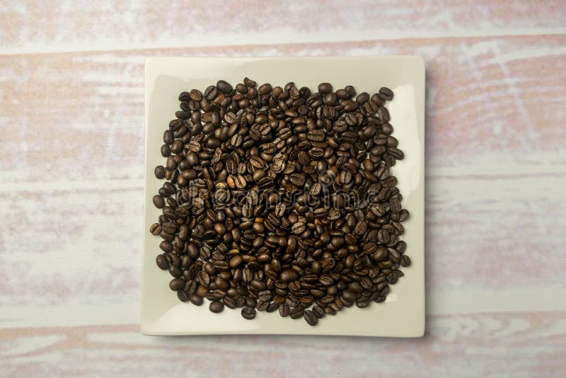 White Square Plate with a Heap of Coffee Beans Stock Photo - Image of ...