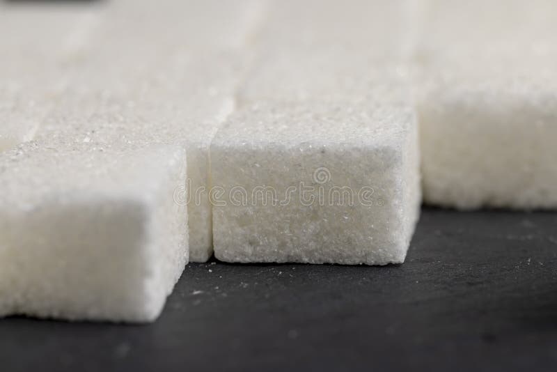 White Square Sugar on a Black Background Stock Photo - Image of ...