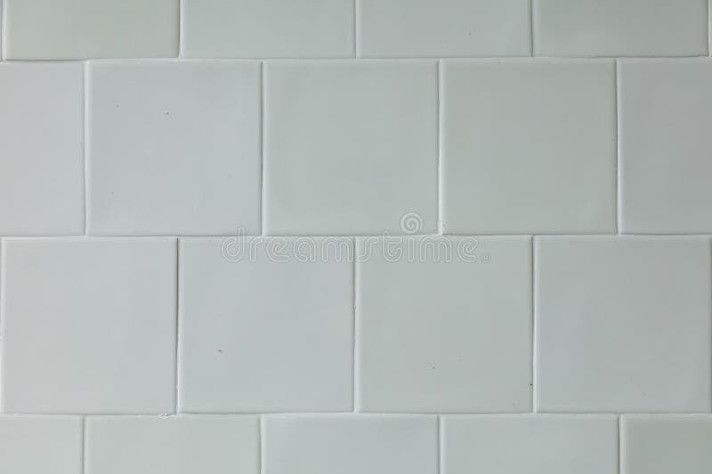White square tile on wall stock photo. Image of material - 317755970