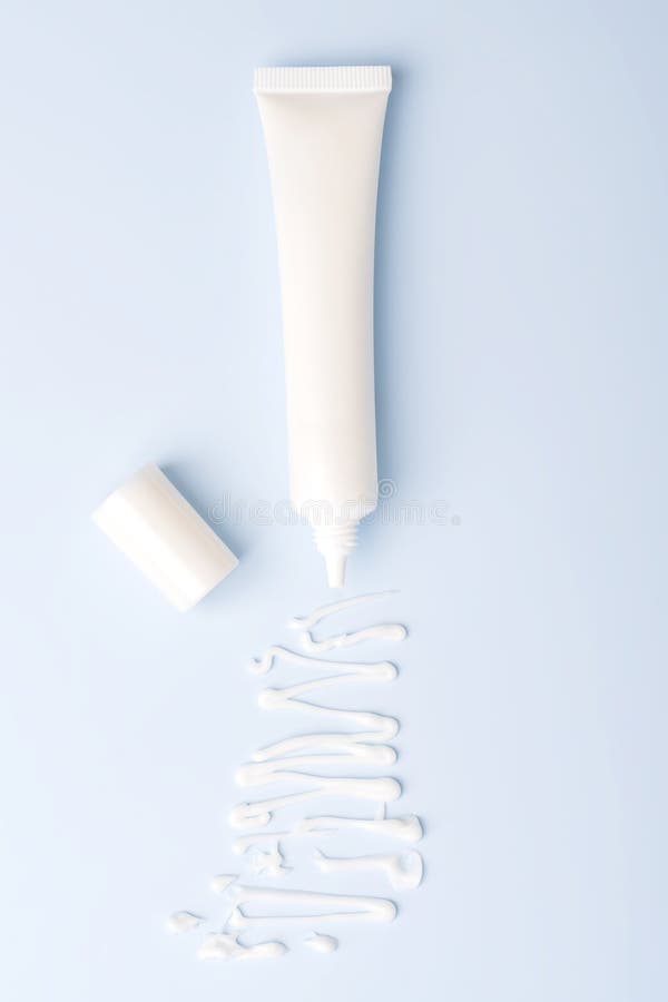 White Squize Tube with Light Eye Cream and Sample Texture on Blue ...