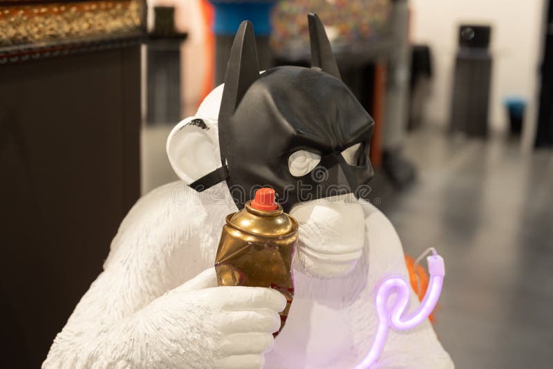 White Statue of a Monkey with a Black Mask on the Eyes Batman Style and ...