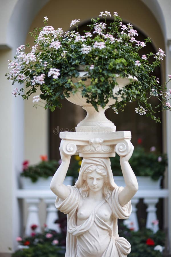 White Statue of Women with Flowers Stock Image - Image of beauty ...