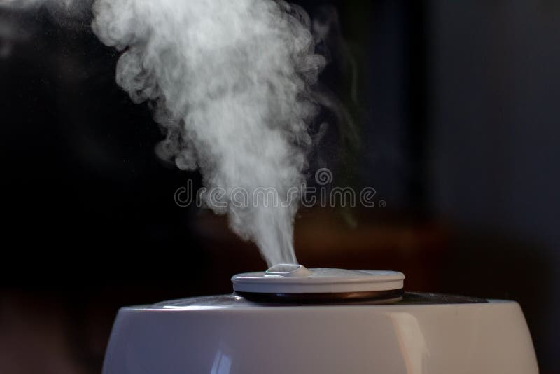 White Steam from a Humidifier on a Black Background Stock Image - Image ...