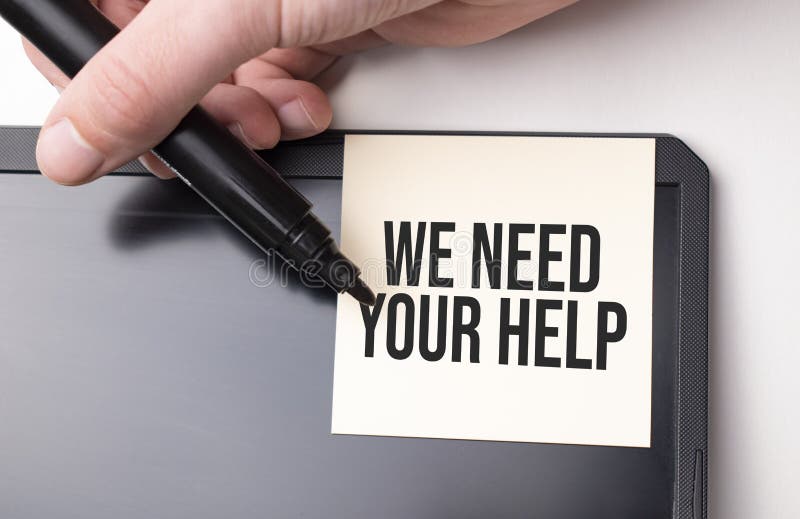 White Sticker on the Monitor in the Office with Text we Need Your Help ...