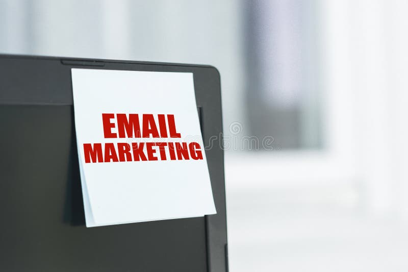 White Sticky Note with Red Text Email Marketing on Laptop Screen Stock ...