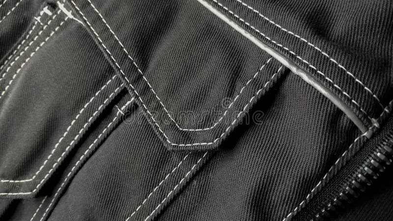 White Stitching on Black Fabric. Texture Black Working Clothes with ...