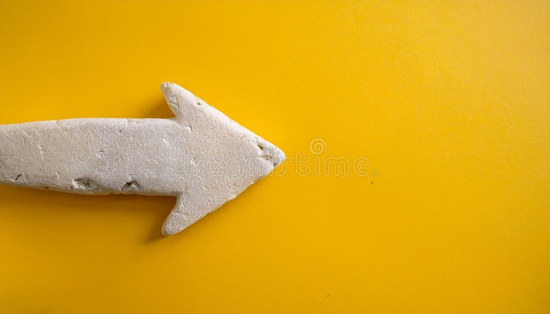 White Stone Arrow Pointing Right on Yellow Backdrop. Direction Guide ...