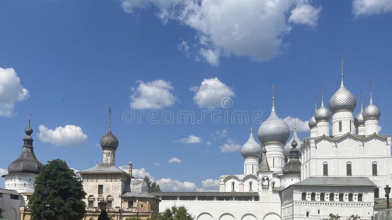 A White-stone Orthodox Monastery Under a Blue Summer Sky with Shaggy ...