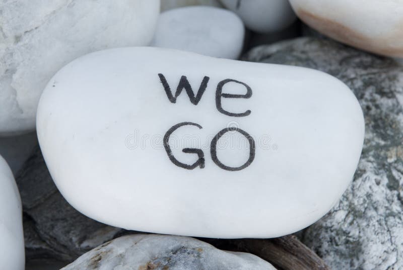 White Stone with Writing we GO in Natural Background Stock Photo ...