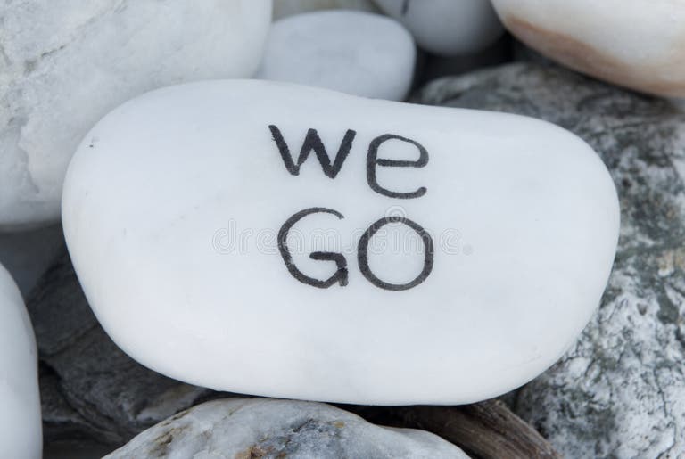 White Stone with Writing we GO in Natural Background Stock Photo ...