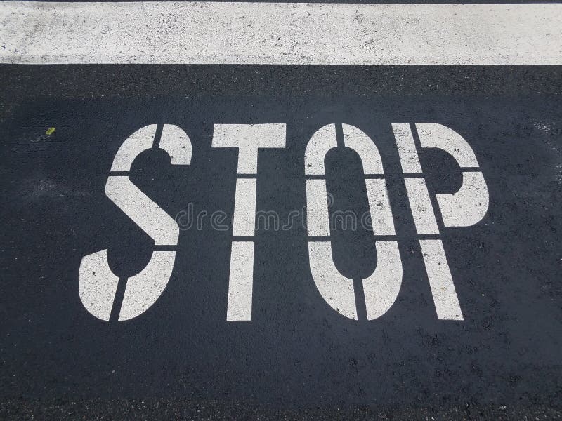 White Stop Sign Painted on Black Asphalt Street Stock Image - Image of ...