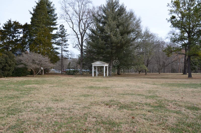 White Structure with Columns in Grass Stock Photo - Image of building ...