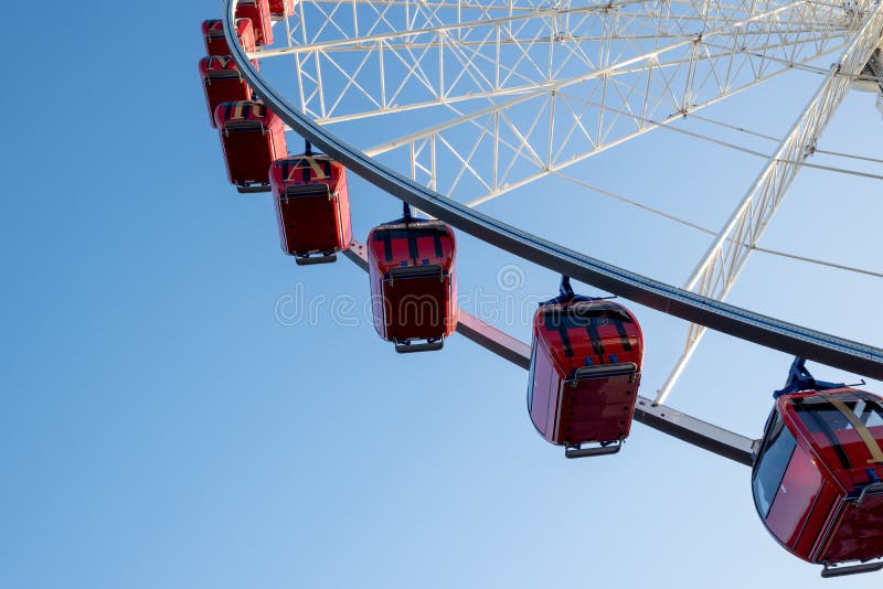 White Structure and Red Cabins of Ferris Wheel with Background of Clear ...