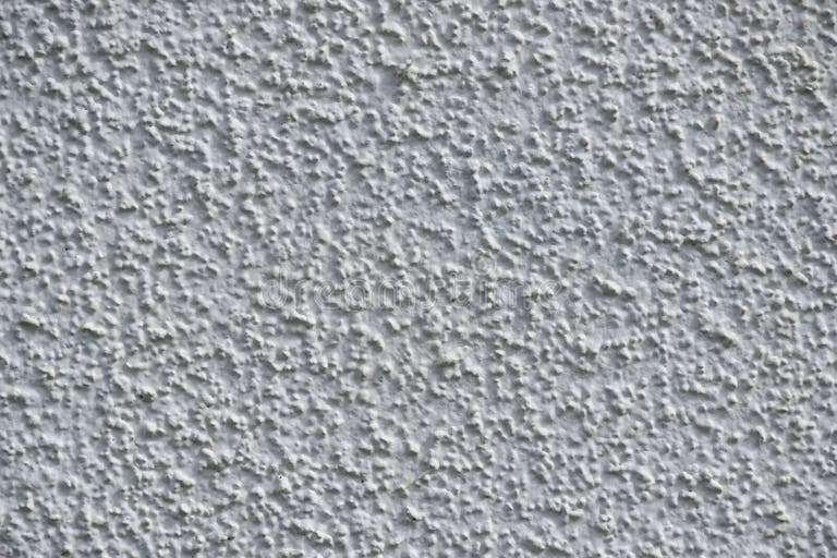 White Stucco Exterior Elevation Surface Closeup. Rough Steepled Grainy ... White Stucco Exterior Elevation Surface Closeup. Rough Steepled Grainy ...