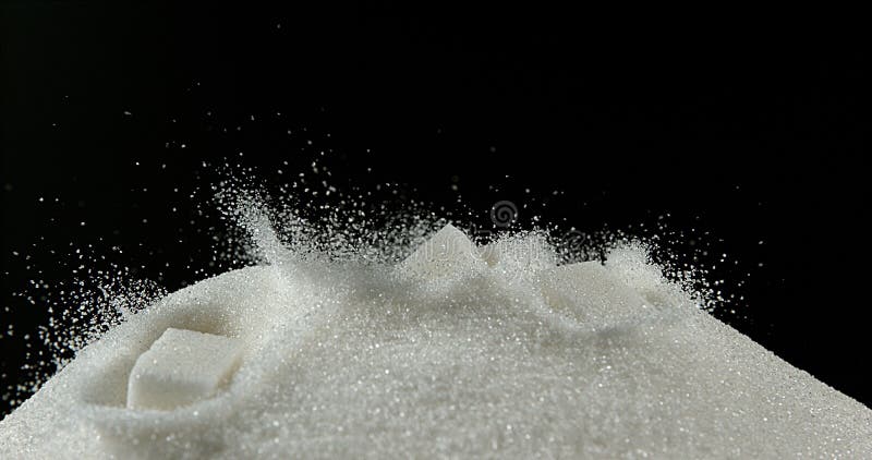 White Sugar Cube Falling on Powder Sugar Against Black Background Stock ...