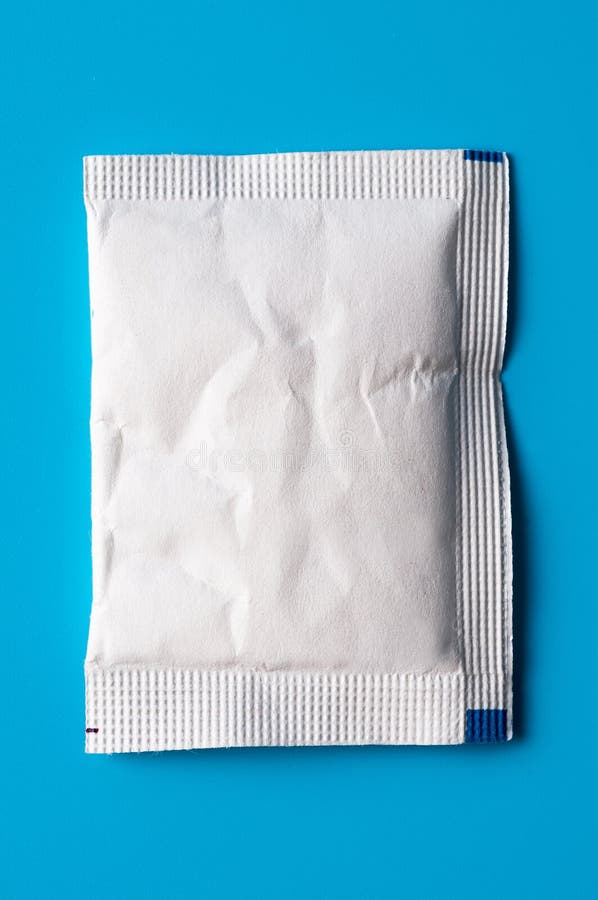 White Sugar Packets on a Blue Background Stock Image - Image of ...