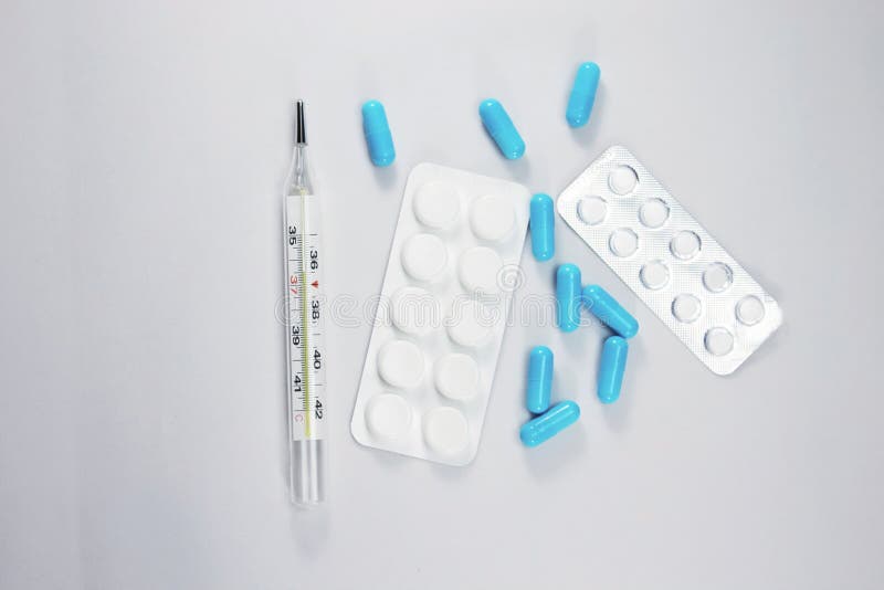 Medication and Thermometer for Measuring Body Temperature Stock Photo ...