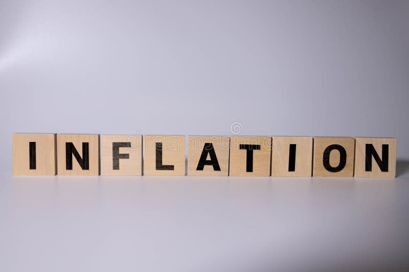 White Surface, with the Word Inflation in Black, Underneath Torn and ...