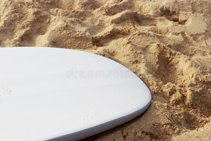 White Surfboard Lying on the Sand Close-up Side View Stock Image ...