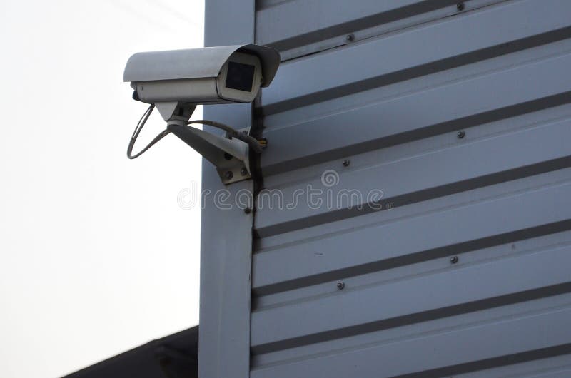 White Surveillance Camera Built into the Metal Wall of the Offic Stock ...