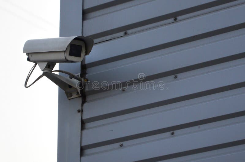 White Surveillance Camera Built into the Metal Wall of the Offic Stock ...