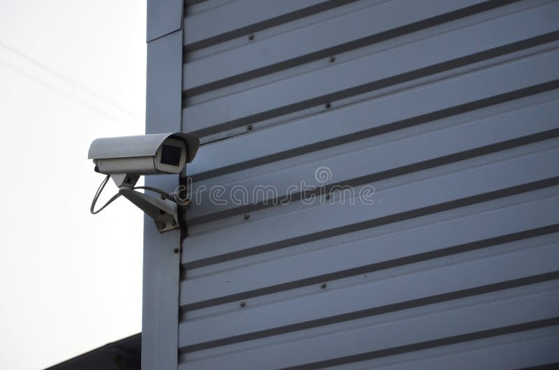White Surveillance Camera Built into the Metal Wall of the Offic Stock ...