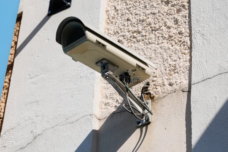 White Surveillance Camera Built in Wall of Building Stock Image - Image ...