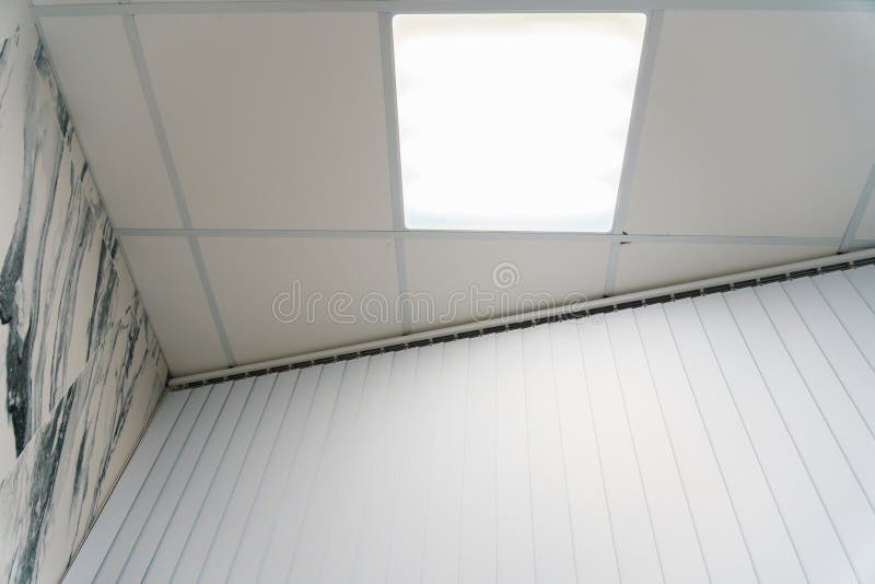 Square Fluorescent Lamps on the Ceiling. Thick Pipes of the Air ...