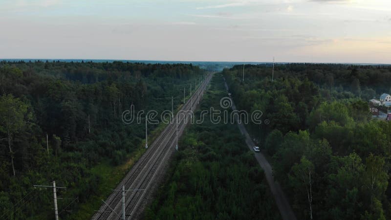 White SUV Drive on the Road Parallel Railways. Aerial View. Stock ...