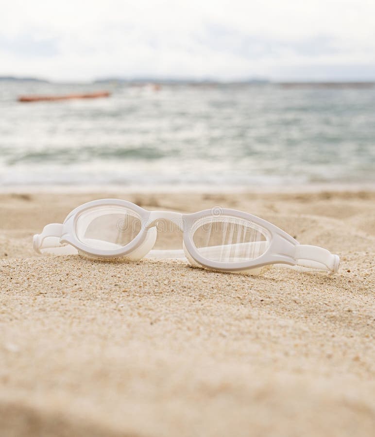 White Swimming Glasses on Sandy Beach Background Stock Photo - Image of ...