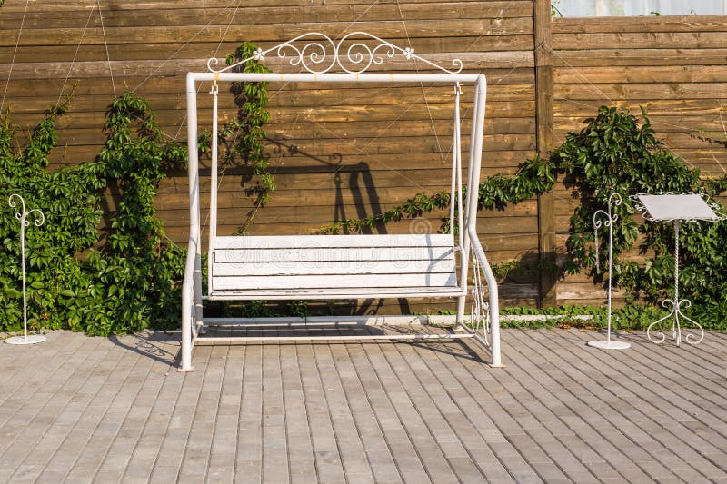 White Swing in a Garden. Concept of Relaxation Stock Photo - Image of ...