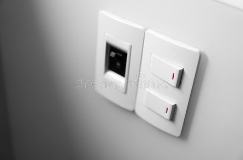 White Switch on a White Wall with Two Switches and One Common Switch ...